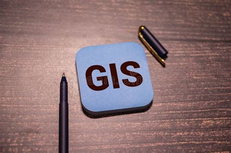 Gis Geographic Information System Write On A Book Isolated On Wooden Table Stock Image Image