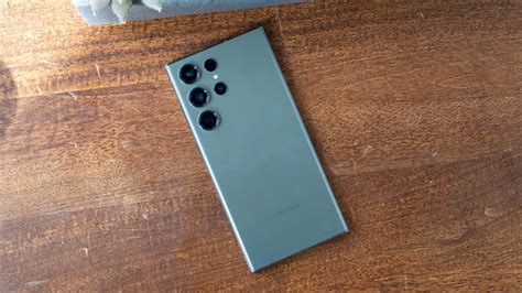 Download Samsung S23 Ultra Green Back Camera Array Wooden Surface