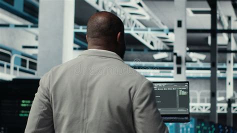 Programmers Walking In Data Center Coding Doing Optimizations Using Tablet Stock Footage