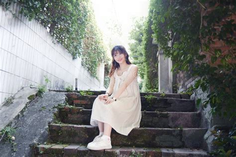 Beautiful And Lovely Asian Girl Shows Her Youth In The Park Stock Image