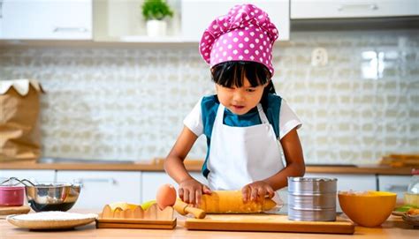 Premium Ai Image Tiny Culinary Master Little Cook In Apron And Chefs