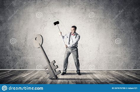 breaking through access concept with man in room crashing concrete key