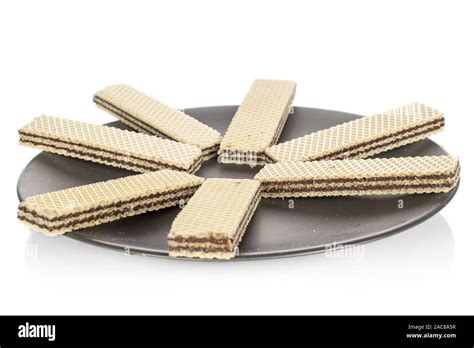 Group Of Seven Whole Sweet Chocolate Biscuit Wafer On Gray Ceramic