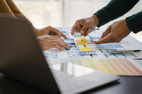 Premium Photo Developer And Ui Designer Brainstorming About Mobile App Interface Wireframe