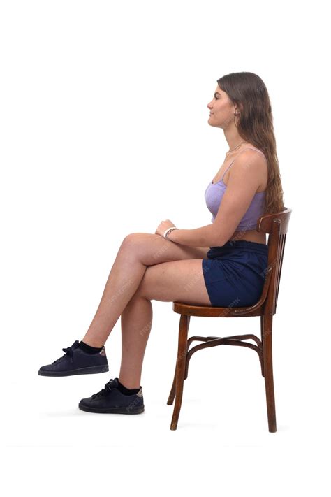 Premium Photo Side View Of A Young Girl Sitting On Chair Cross Legged
