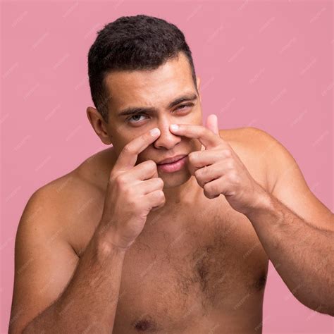 Free Photo Front View Of Man Trying To Pop Pimple On His Nose