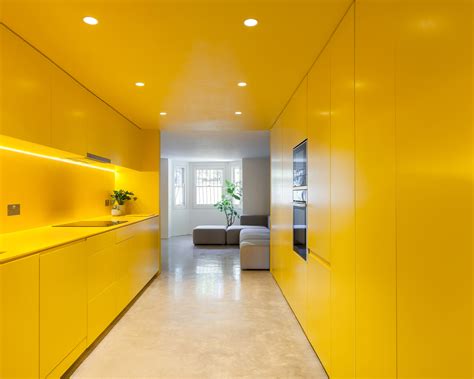 Yellow Kitchen Brightens Basement Of North London Home