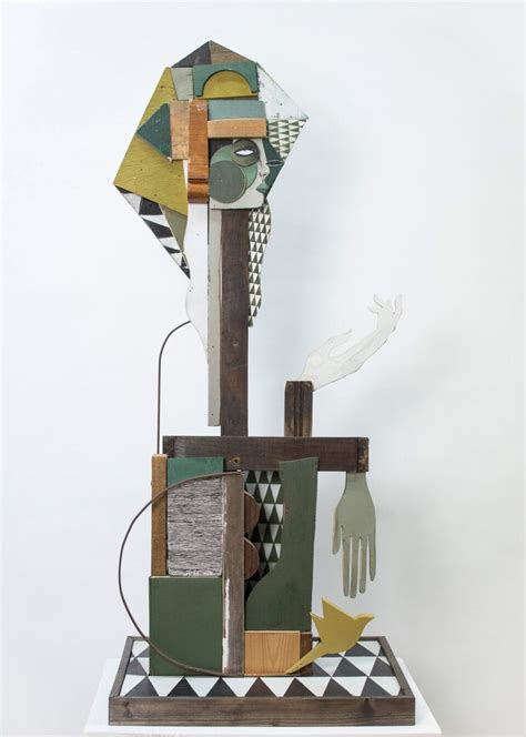 Geometric Shapes And Angular Faces Combine In New Salvaged Wood Murals