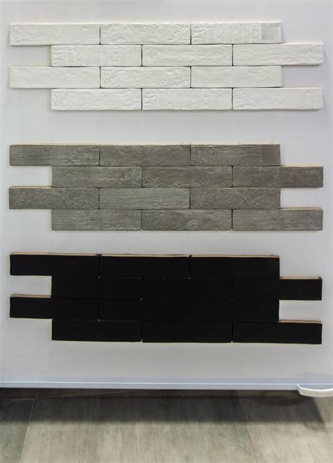 Three Panels With Rectangular Tile Samples In White Grey Black