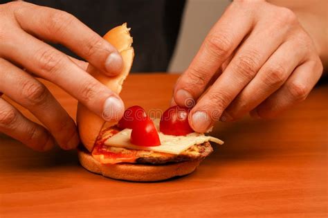 Cooking Hamburger Close Up Shot Of Young Man Eats Burger Home