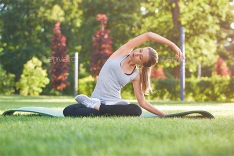 Young Woman Practicing Yoga Outdoors At The Park Outdoor Yoga How To