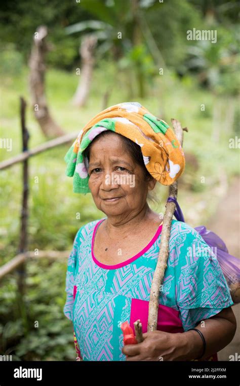 Portrait Of An Elderly Woman With Traditional Head Covering On The
