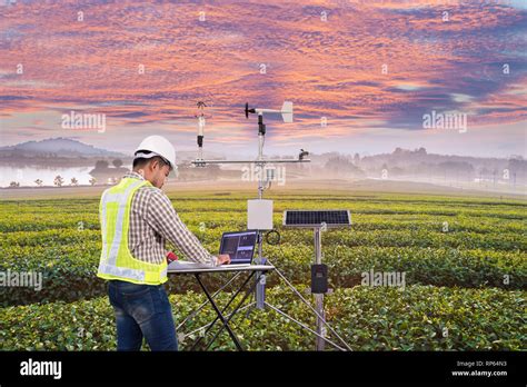 agronomist using tablet computer collect data with meteorological