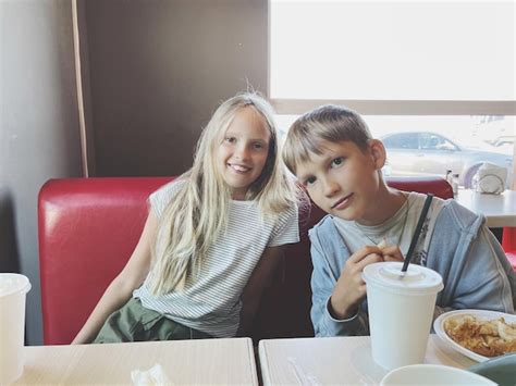 Premium Photo Portrait Of Siblings In The Cafe