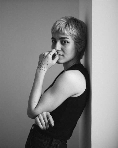 A Woman Leans Against A Wall And Poses Photo Free Portrait Image On Unsplash