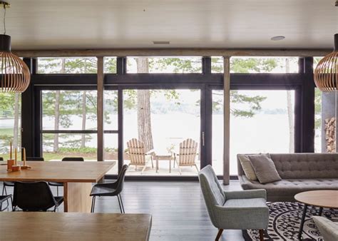 allee separates lakeside connecticut house into two distinct volumes