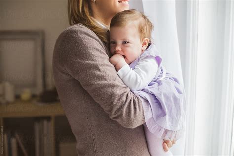 Mother Holding Her Daughter By Stocksy Contributor Lumina Stocksy