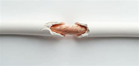 Damaged Electrical Wire Close Up With Exposed Copper Strands Broken