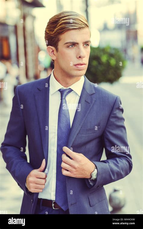 Portrait Of An Attractive Young Businessman In Urban Background Wearing