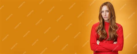 Premium Photo Suspicious Intense And Defensive Ginger Girl Standing