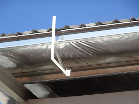 Installation Of The Aluminum Cladding Frame At The End Of The Roof Is