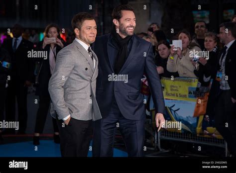 Actors Taron Egerton Left And Hugh Jackman Pose For Photographers Upon