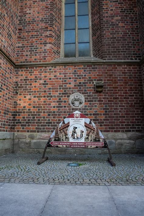 Historic Brick Wall With Arched Window And View Point Sign In Wroclaw