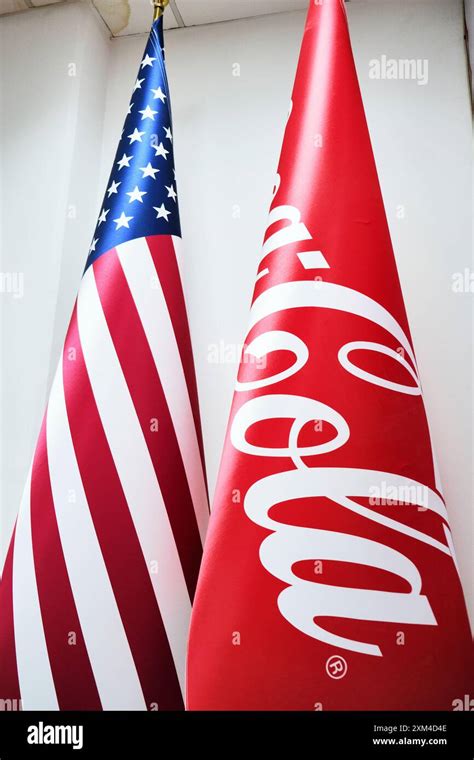 Two Flags Side By Side The Usa And Coca Cola Flags At The Cci Coca