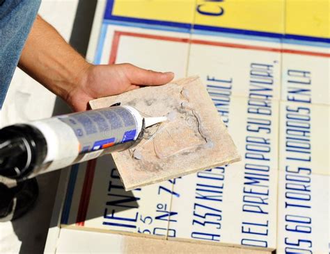 Ceramist Makes The Assembly Of A Panel Of Tiles Glazed In His Workshop