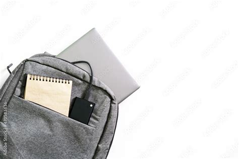 Gray Urban Backpack With Laptop Notepad And External Ssd On A White