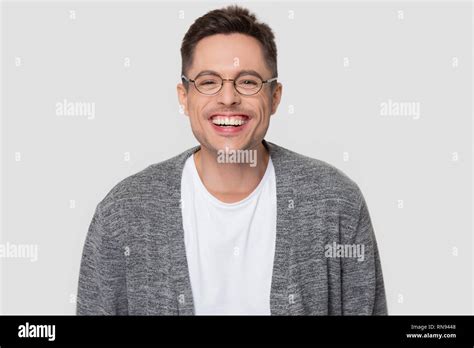Funny Happy Millennial Man Wearing Glasses Laughing Looking At Camera