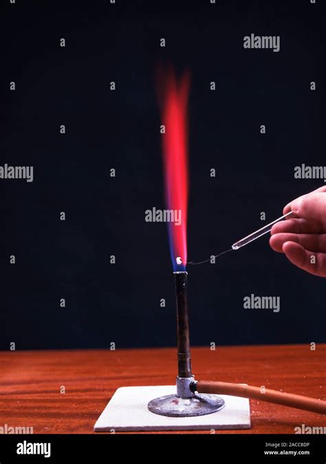 Flame Test Lithium Burning In The Flame Of A Bunsen Burner Producing A