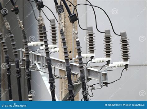 High Voltage Cable Terminators And Lightning Arresters Installed On Concrete Electrical Pole