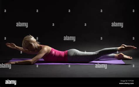 Woman Exercising Pilates Contralateral Limb Raises Exercise Stock