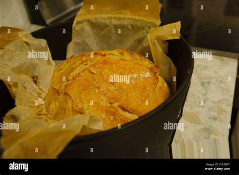 Overhead View Of A Black Dutch Golden Crust Bread With Parchment Paper