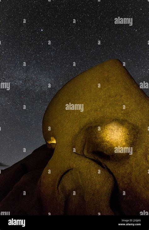 Skull Rock Lit Up At Night In Joshua Tree National Park California