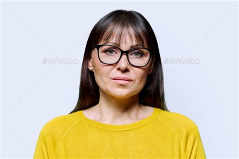 Headshot Portrait Of Serious Mature Woman On White Studio Background Stock Photo By