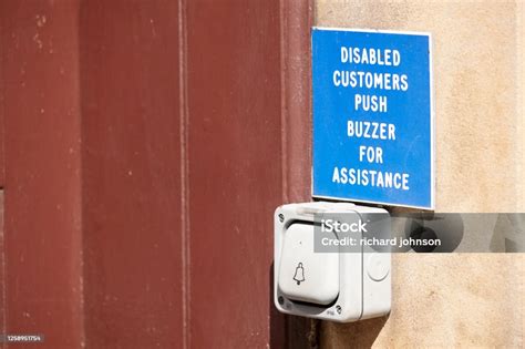 Disabled Accessible Push Button Buzzer For Assistance Sign At Shop