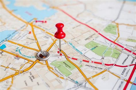 Premium Photo A Small Map With A Red Pin On It