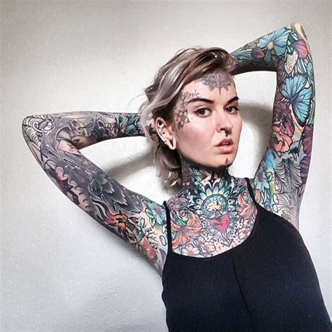 Download A Woman With Tattoos On Her Arms And Shoulders