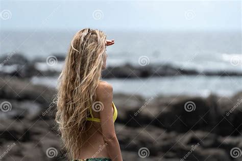Rear View Of Blonde Woman With Fit Body Looking The Seascape Travel