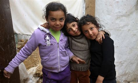 Syrian Refugee Girls Pose For A Picture At A Refugee Camp In The Eastern Lebanese Town Of Al