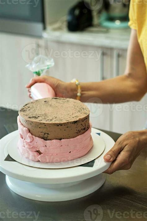 Woman Making Chocolate Cake With Pink Cream Close Up Cake Making