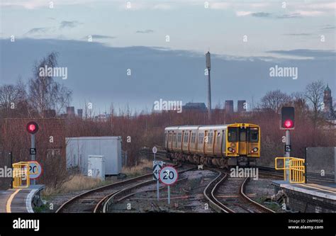 Merseyrail Electrics Class 507 Third Rail Electric Train 507007 Departing From Rock Ferry