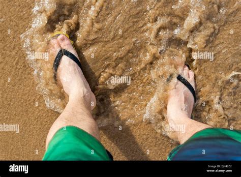 Top To Bottom View Of Feet On The Beach Sand Barra Beach Lighthouse