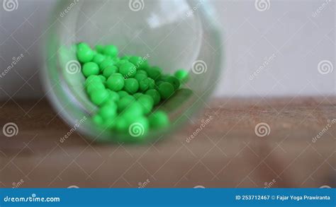 Two Bullets With A Stainless Revolver In The Background Royalty Free