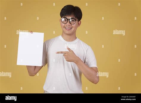 Portrait Of Smiling Happy Cheerful Young Asian Man Dressed Casually