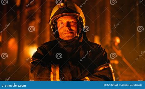 Portrait Of A Brave Handsome Young Adult Firefighter In Safety Uniform