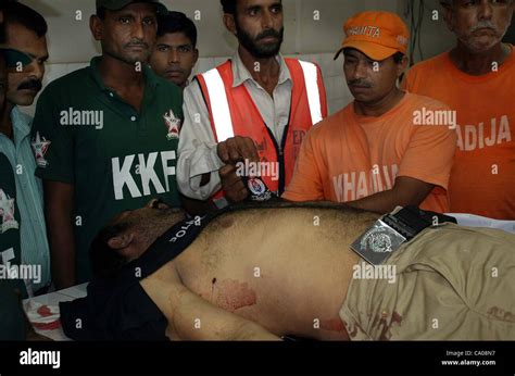 Volunteers Look Dead Body Of A Robber Who Was In Police Uniform And Was