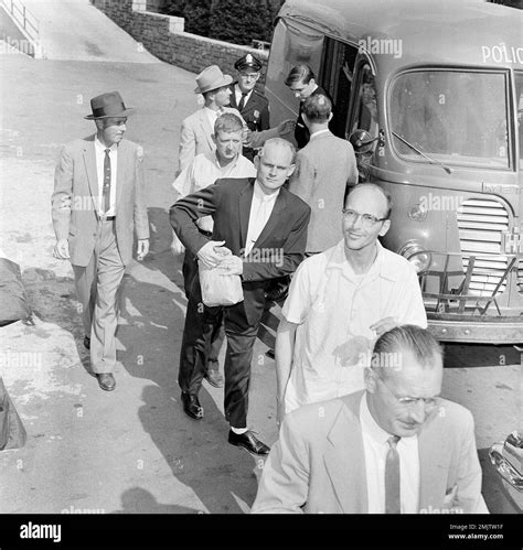 Men Held In The Bombing Early Sunday Of The Jewish Temple Are Helped